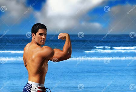 Bodybuilder on the beach stock image. Image of independence - 20108231