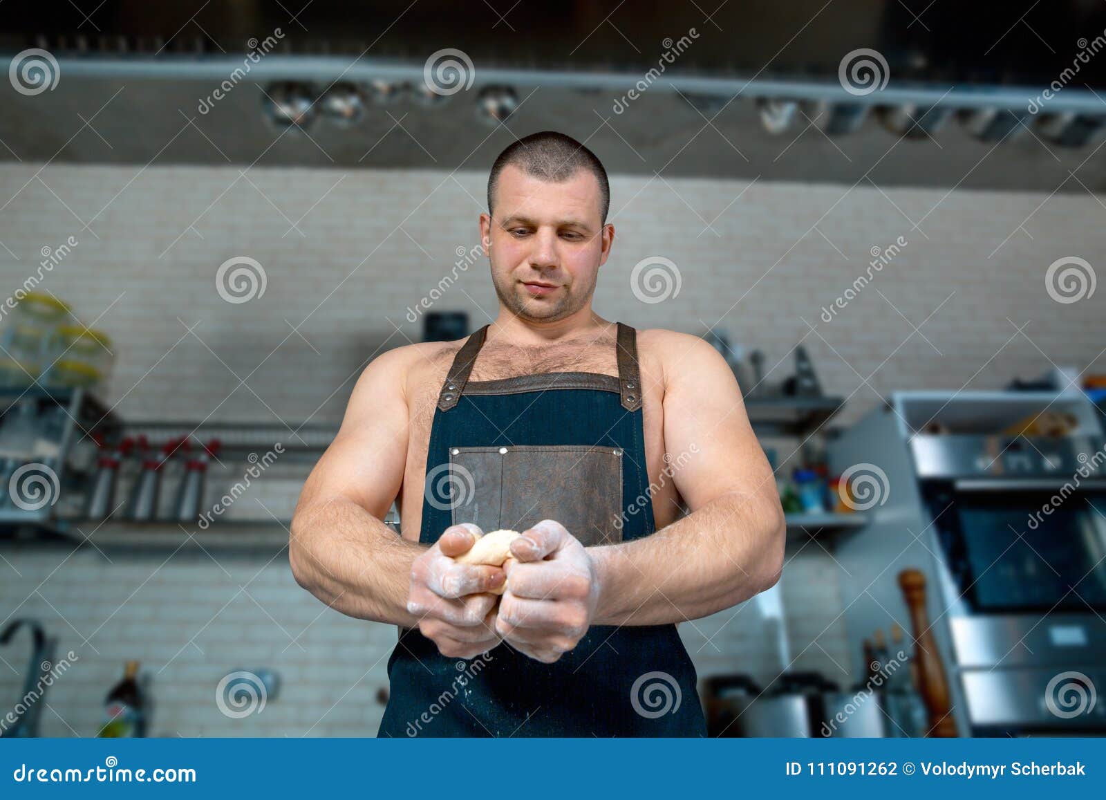 Bodybuilder Chef in Hotel or Restaurant Kitchen Knead the Dough on the ...