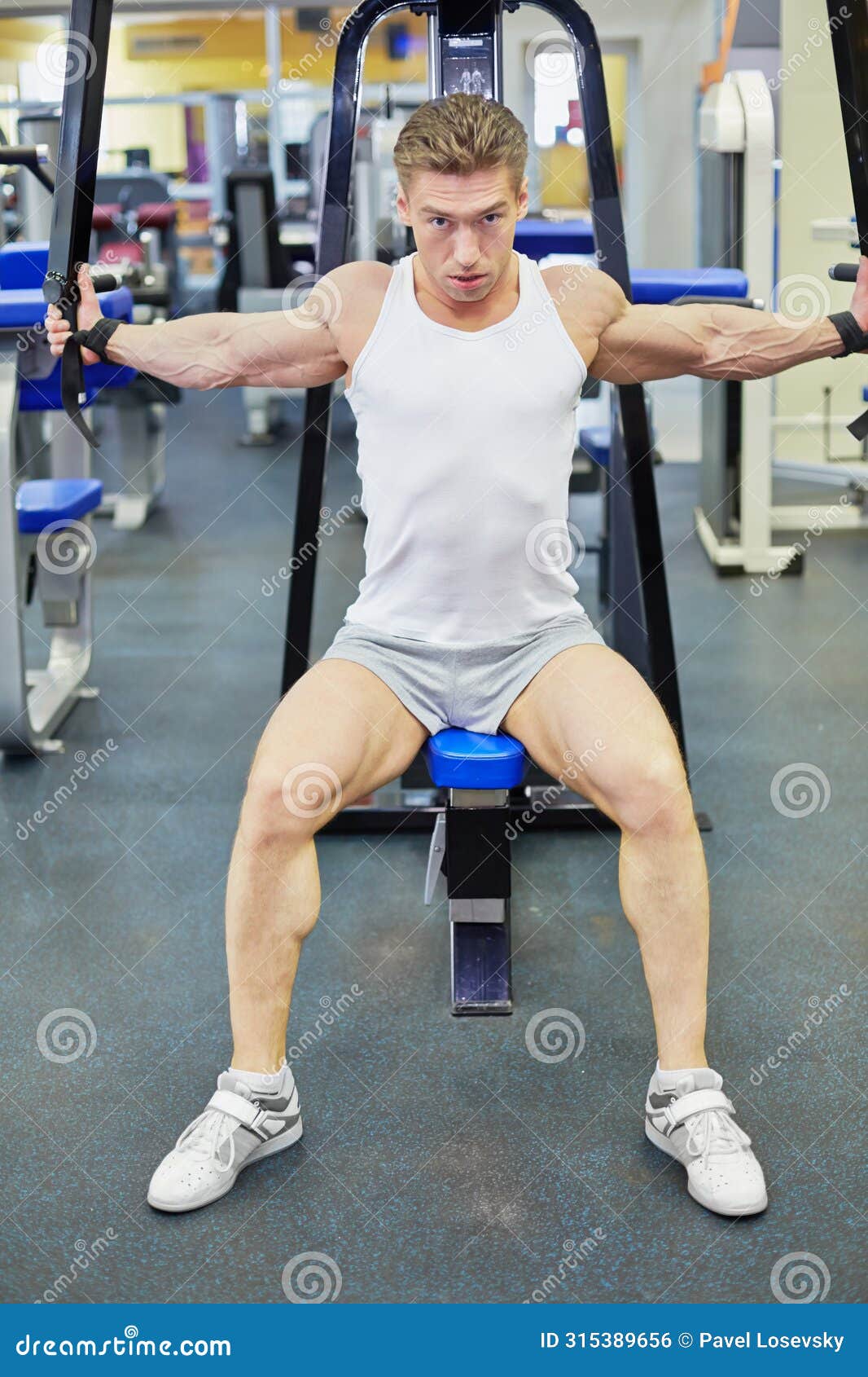 Bodybuilder Does Shoulders Exercises in Gym Stock Photo - Image of ...