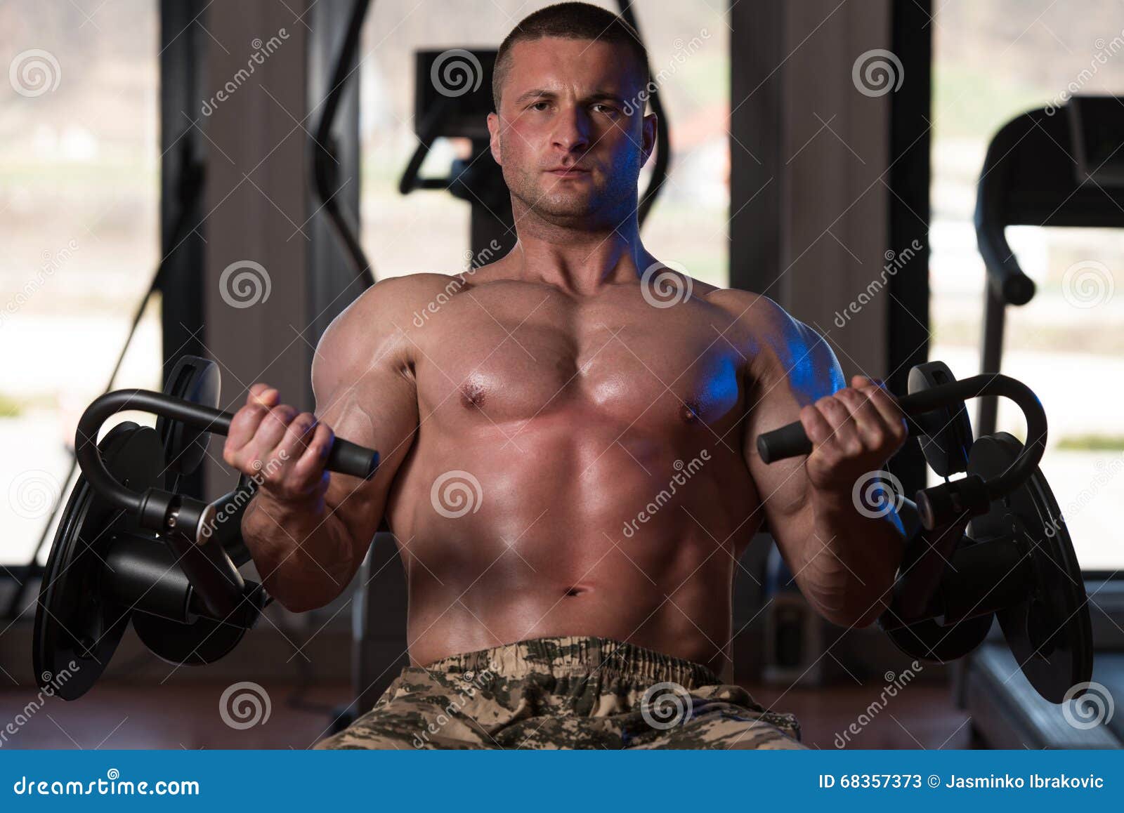 Bodybuilder Doing Exercise for Biceps with Machine Stock Image - Image ...