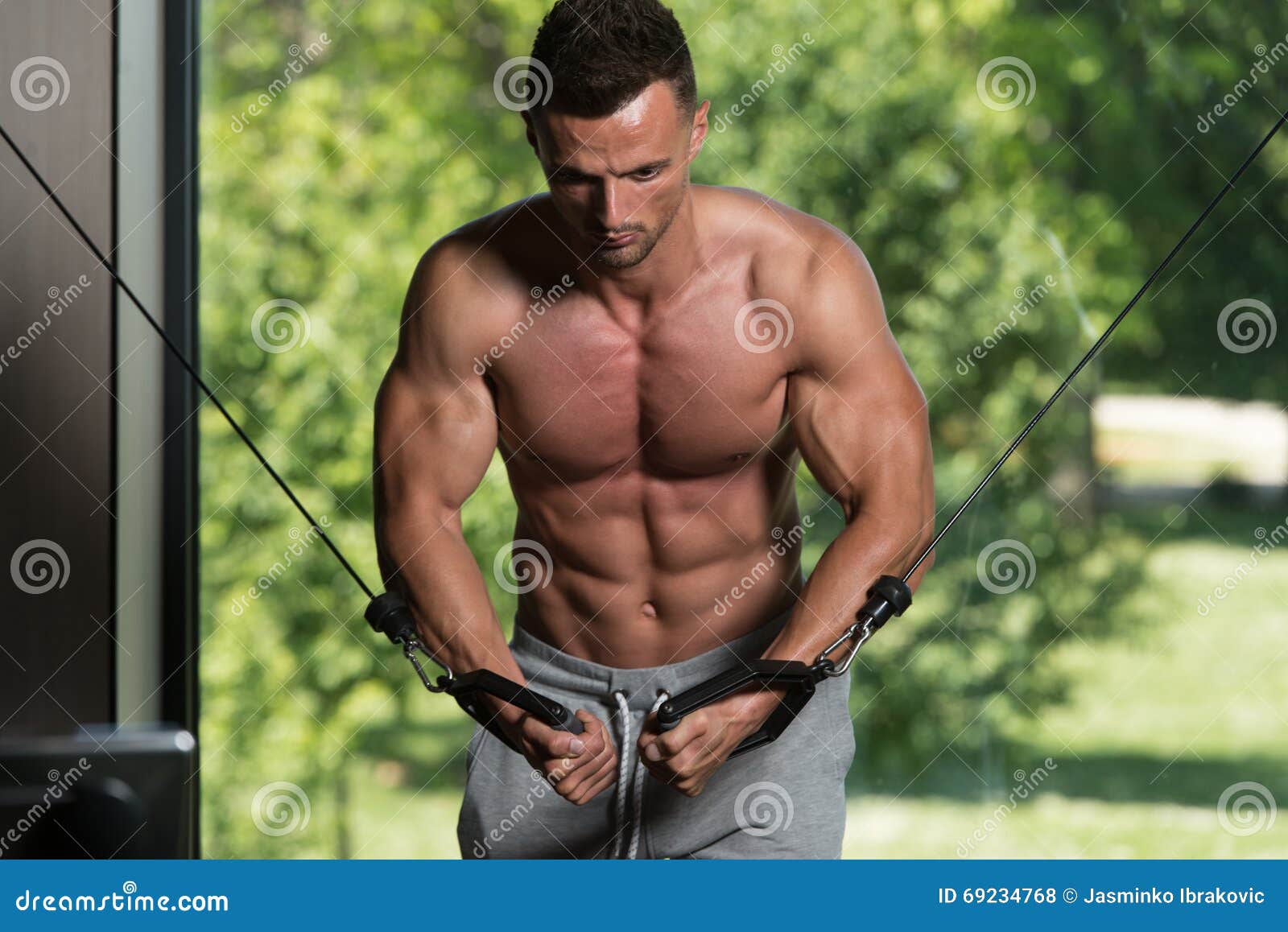Bodybuilder Doing Exercise for Chest on Machine Stock Photo - Image of ...