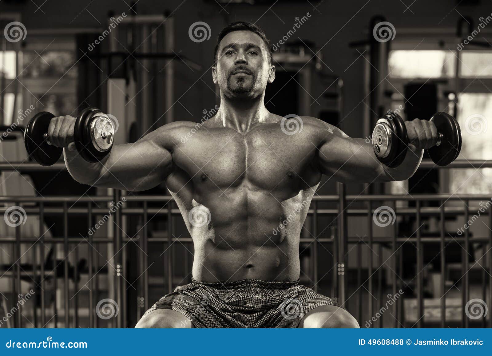 Bodybuilder Doing Exercise for Shoulders Stock Photo - Image of indoors ...