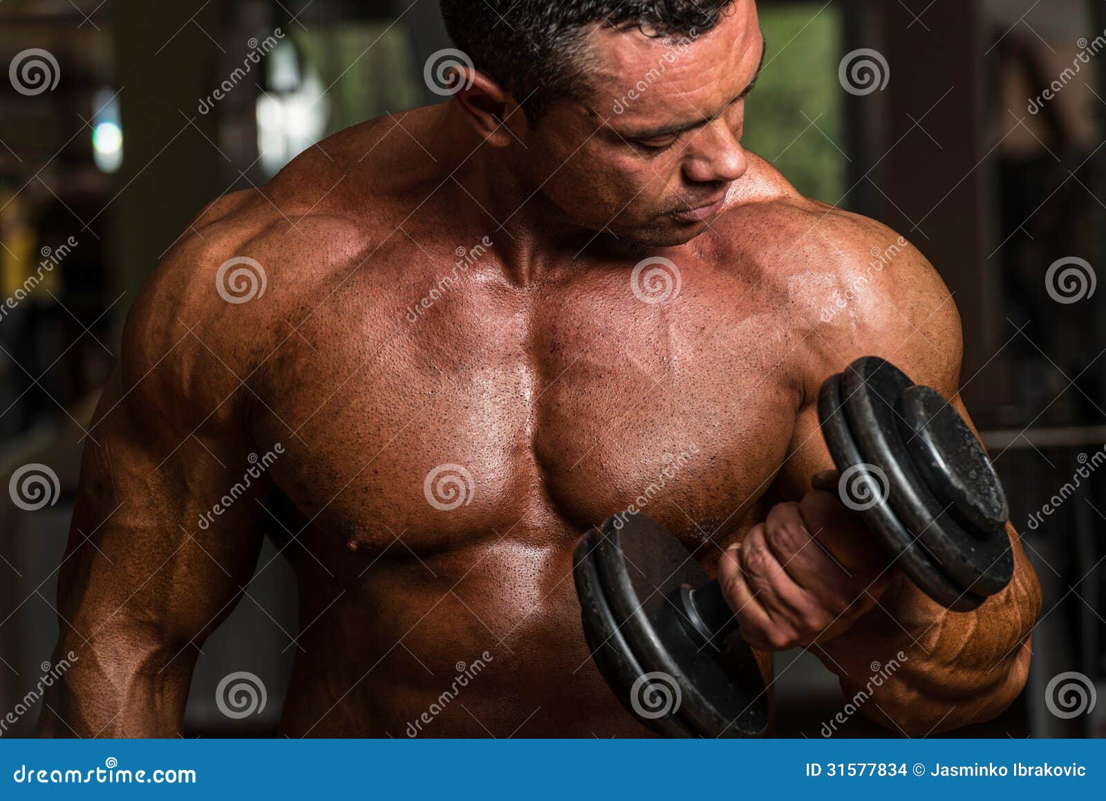 Bodybuilder Doing Heavy Weight Exercise for Biceps with Dumbbell Stock ...