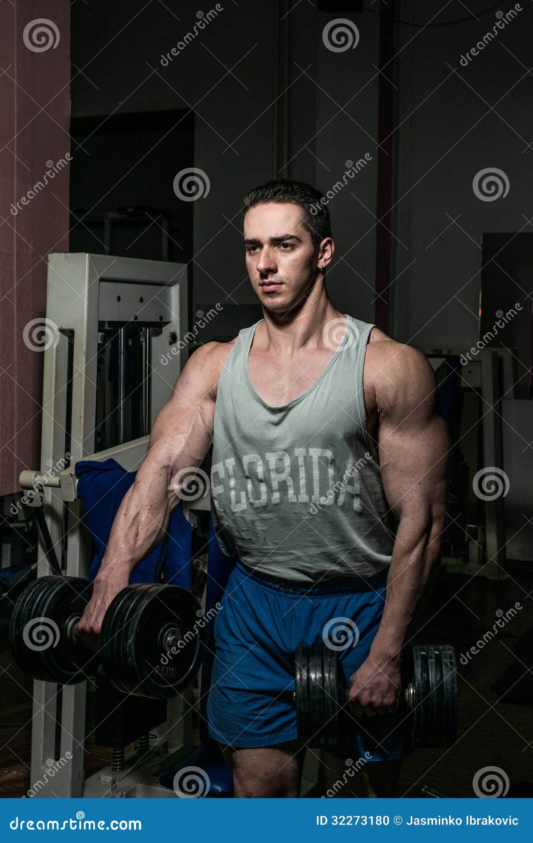 Bodybuilder Doing Heavy Weight Exercise for Shoulder White Dumbbell ...