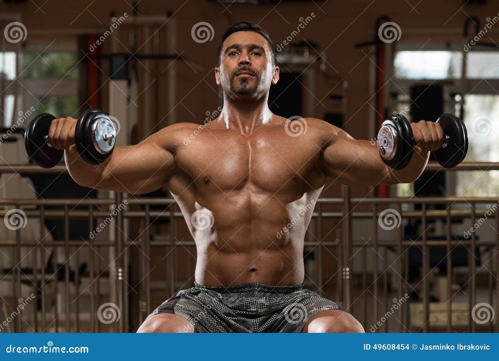 Bodybuilder Doing Heavy Weight Exercise for Shoulders Stock Photo ...