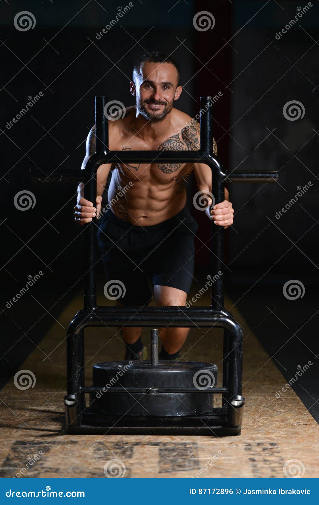 Man in the Gym Exercising Sled Push Stock Photo - Image of build ...