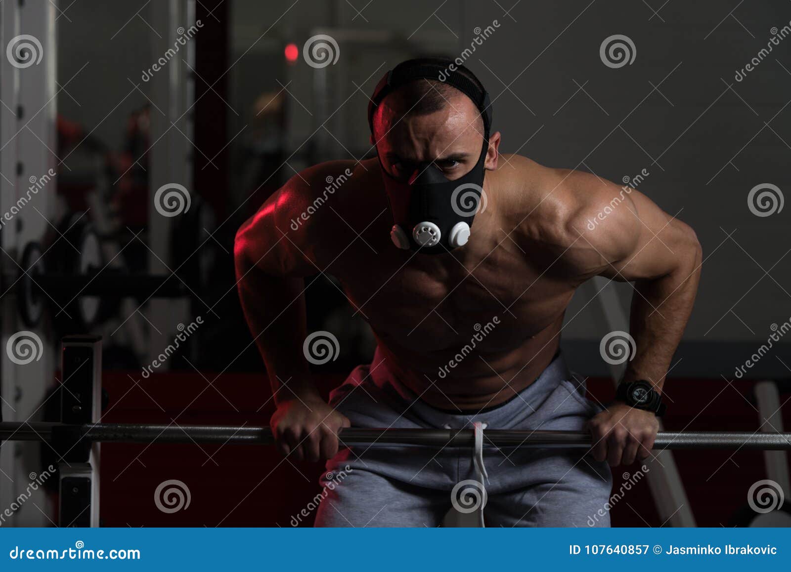Athlete Exercising Push-Ups on Barbell in Elevation Mask Stock Image ...