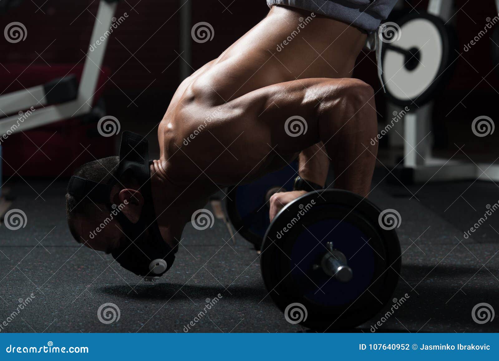 Bodybuilder Exercising Push-Ups on Barbell in Elevation Mask Stock ...