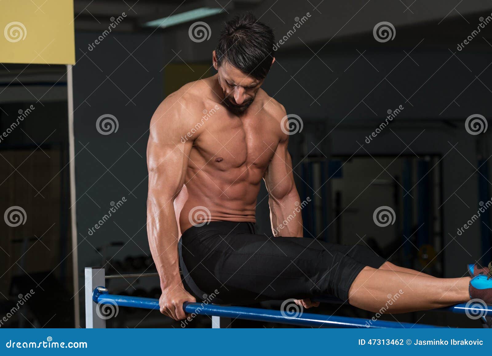 Bodybuilder Exercising on Parallel Bars Stock Photo - Image of ...