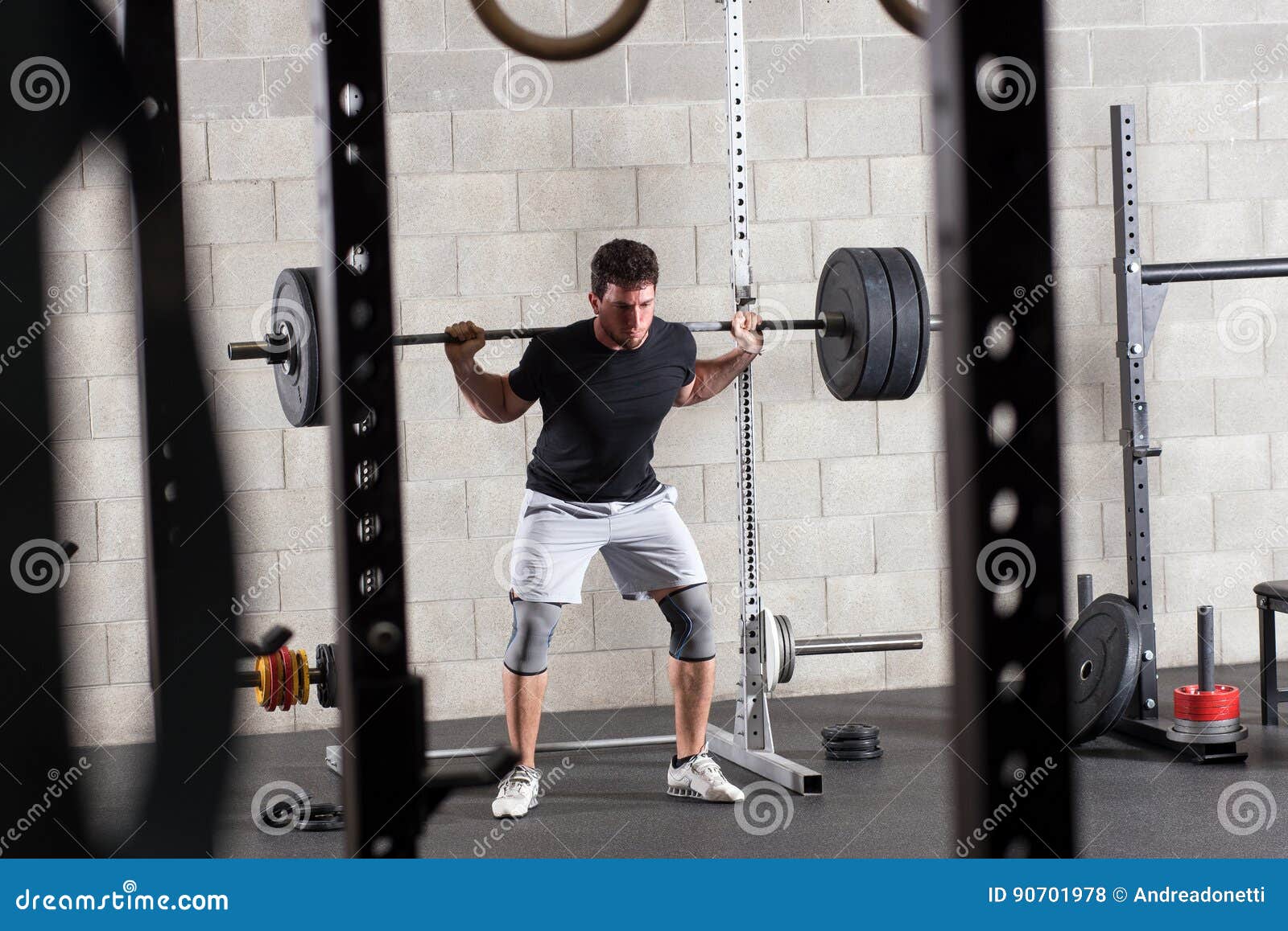 Bodybuilder Exercising on Squat Rack Stock Photo - Image of ...