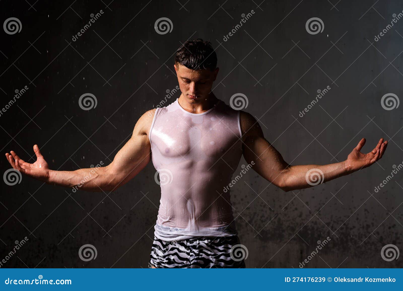Athlete Bodybuilder Trains in the Studio in the Rain. Stock Image ...