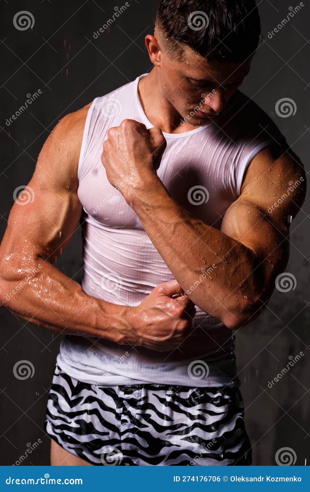 Athlete Bodybuilder Trains in the Studio in the Rain. Stock Photo ...