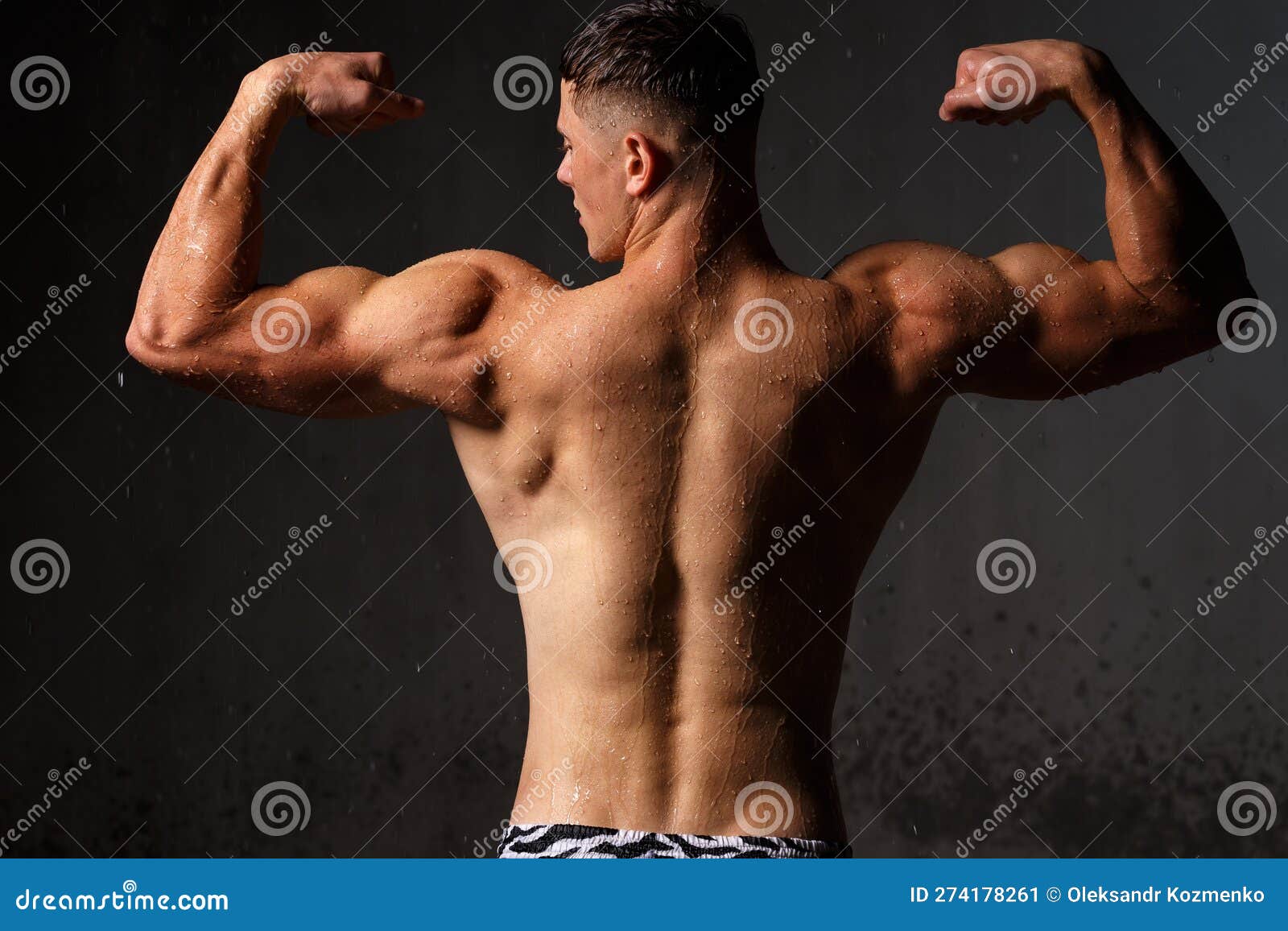 Athlete Bodybuilder Trains in the Studio in the Rain. Stock Image ...