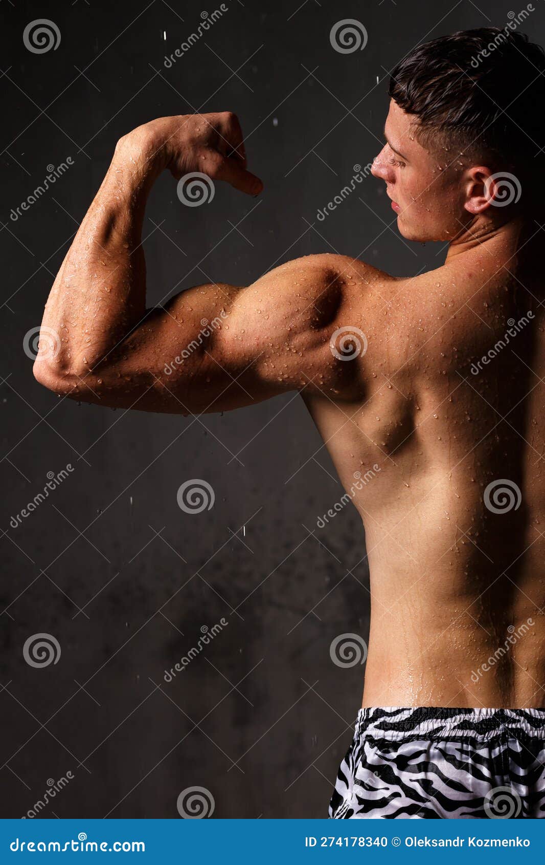 Athlete Bodybuilder Trains in the Studio in the Rain. Stock Photo ...