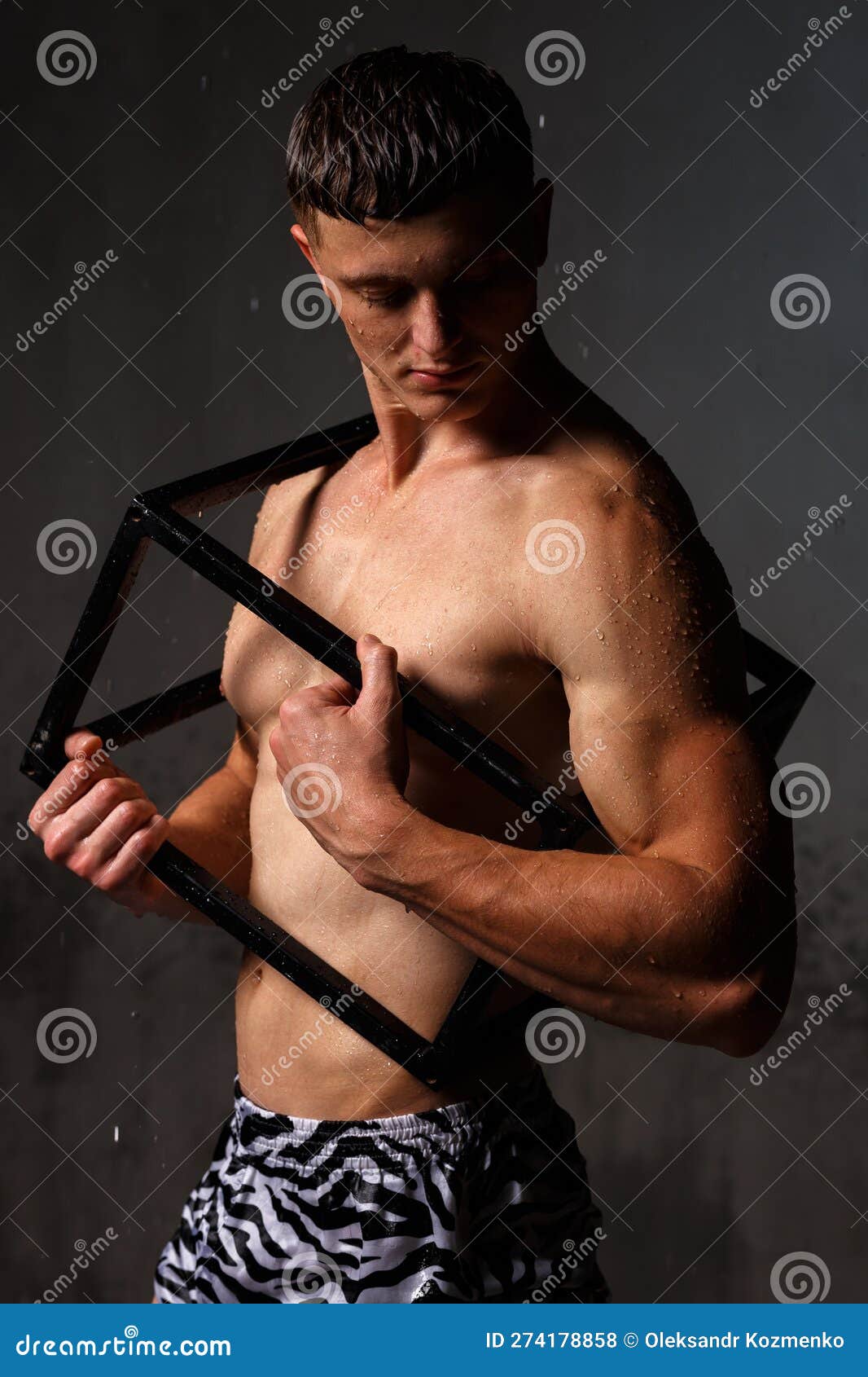 Athlete Bodybuilder Trains in the Studio in the Rain. Stock Photo ...