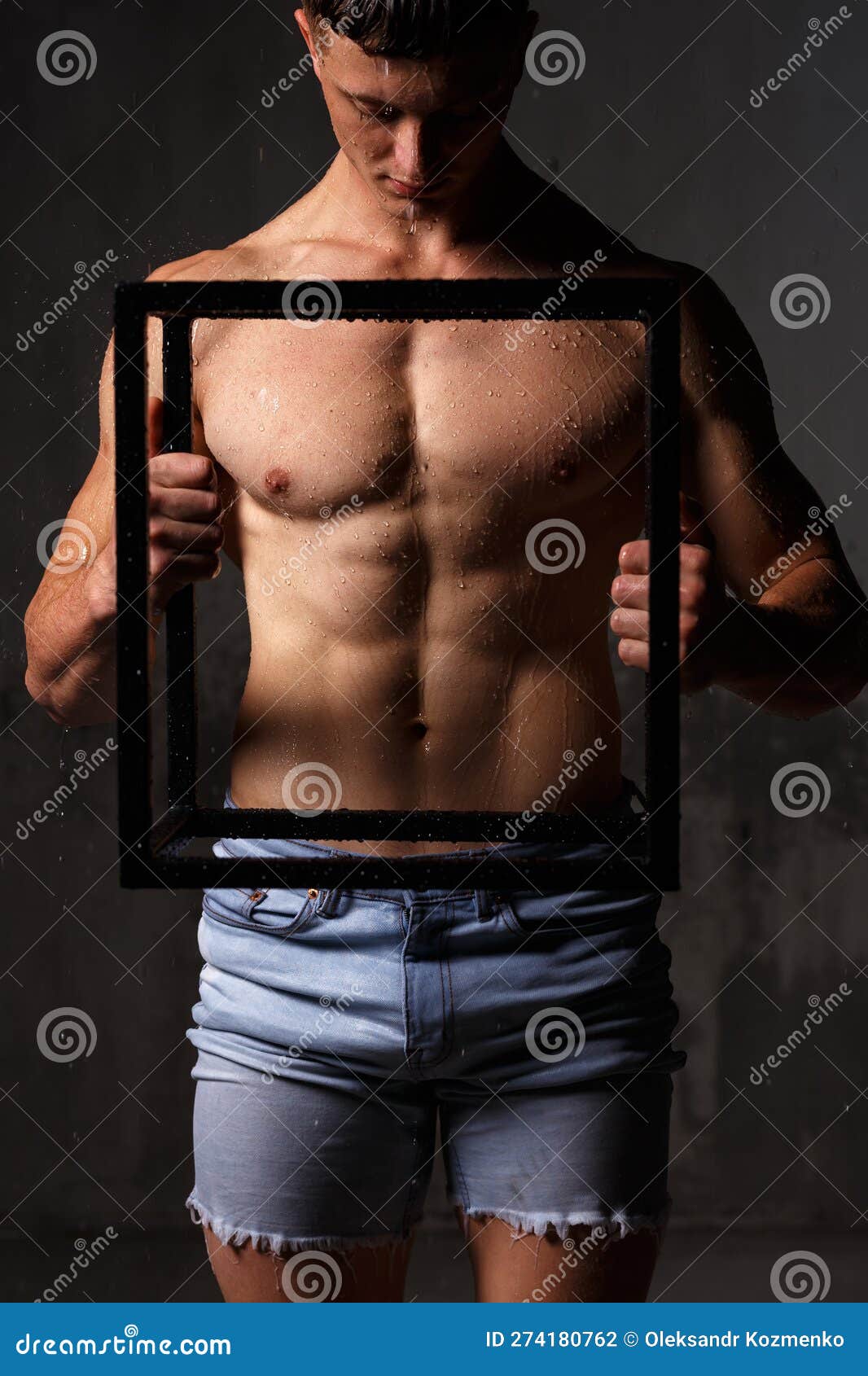 Athlete Bodybuilder Trains in the Studio in the Rain. Stock Photo ...