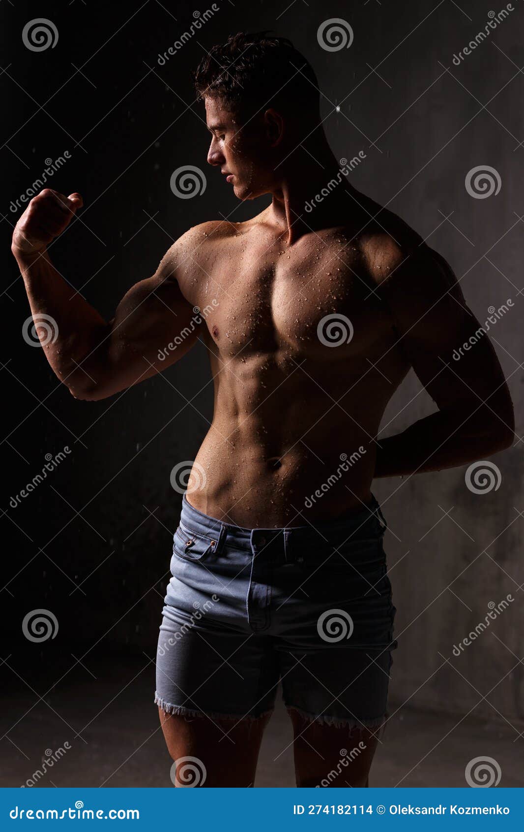 Athlete Bodybuilder Trains in the Studio in the Rain. Stock Photo ...