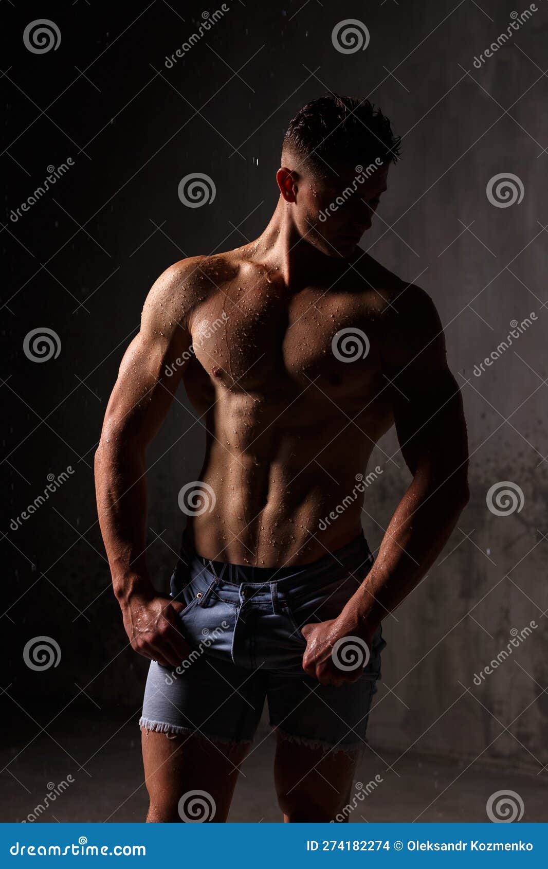 Athlete Bodybuilder Trains in the Studio in the Rain. Stock Photo ...
