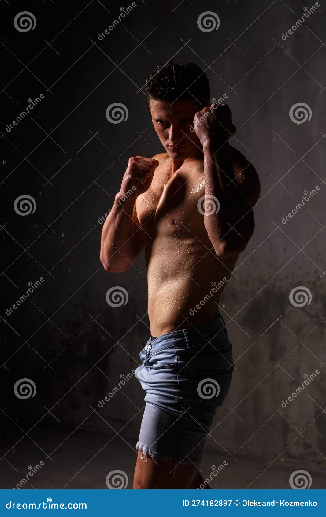 Athlete Bodybuilder Trains in the Studio in the Rain. Stock Image ...