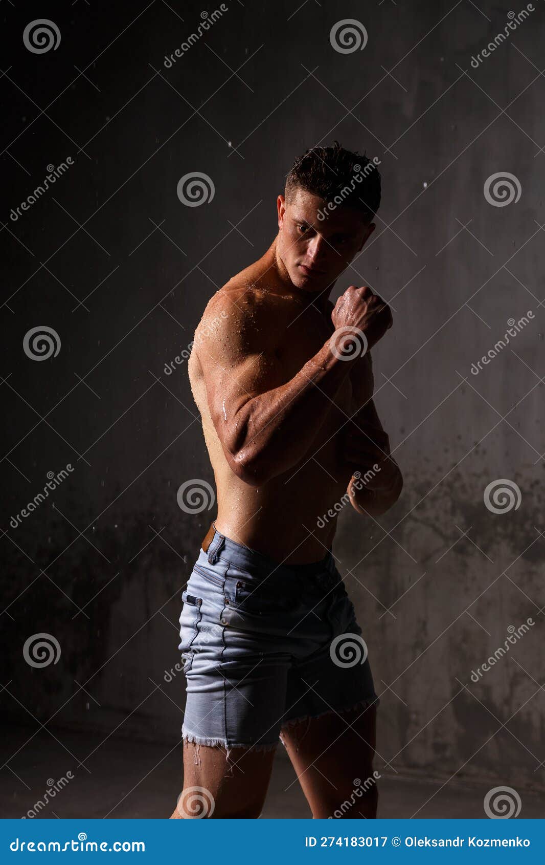 Athlete Bodybuilder Trains in the Studio in the Rain. Stock Image ...