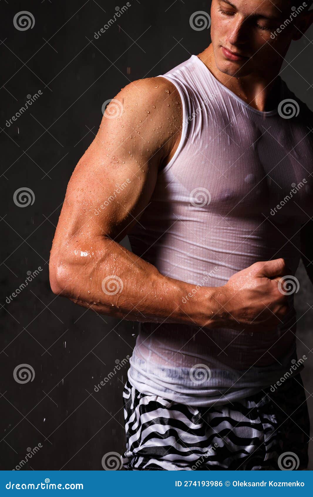 Athlete Bodybuilder Trains in the Studio in the Rain. Stock Photo ...