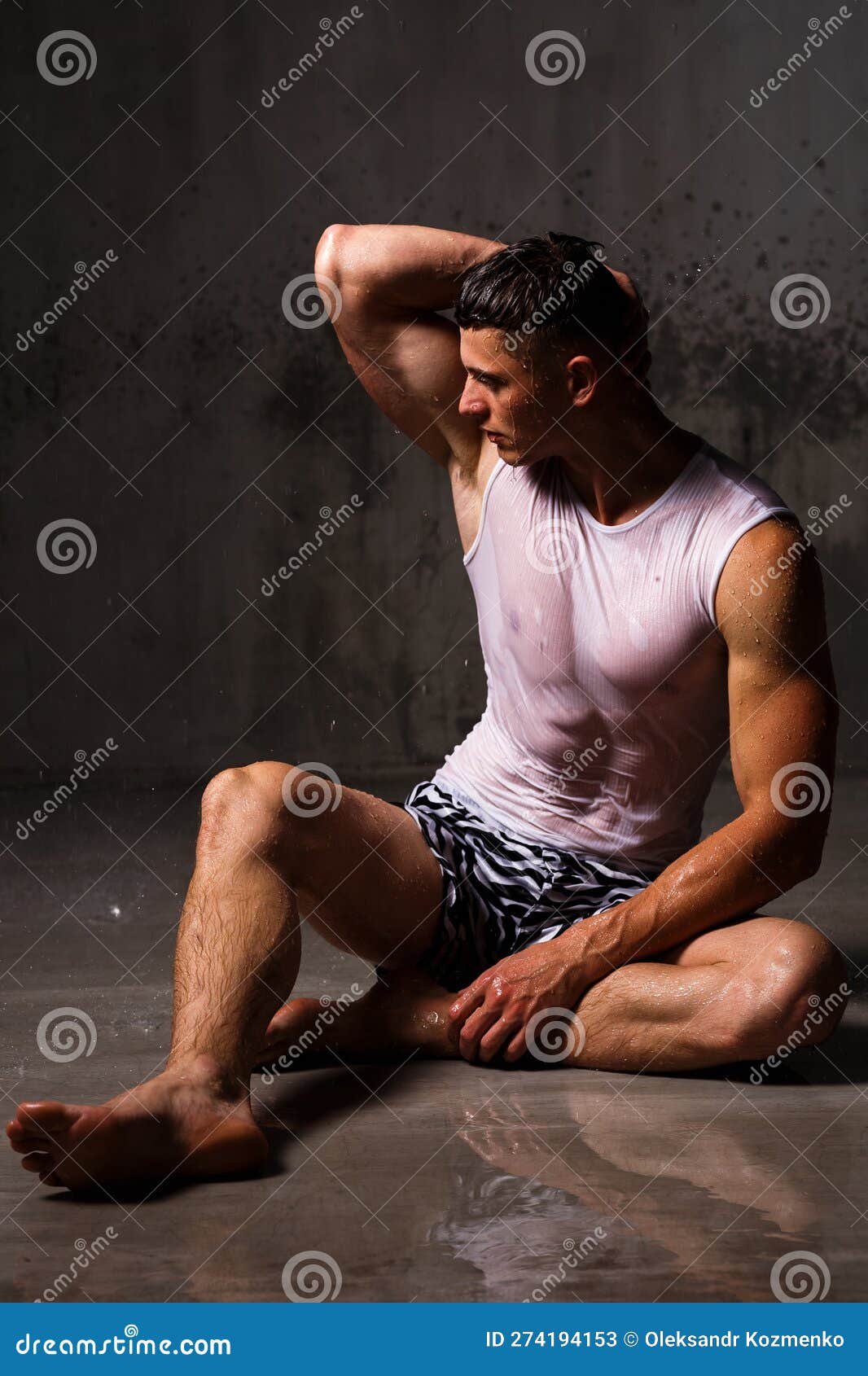 Athlete Bodybuilder Trains in the Studio in the Rain. Stock Image ...