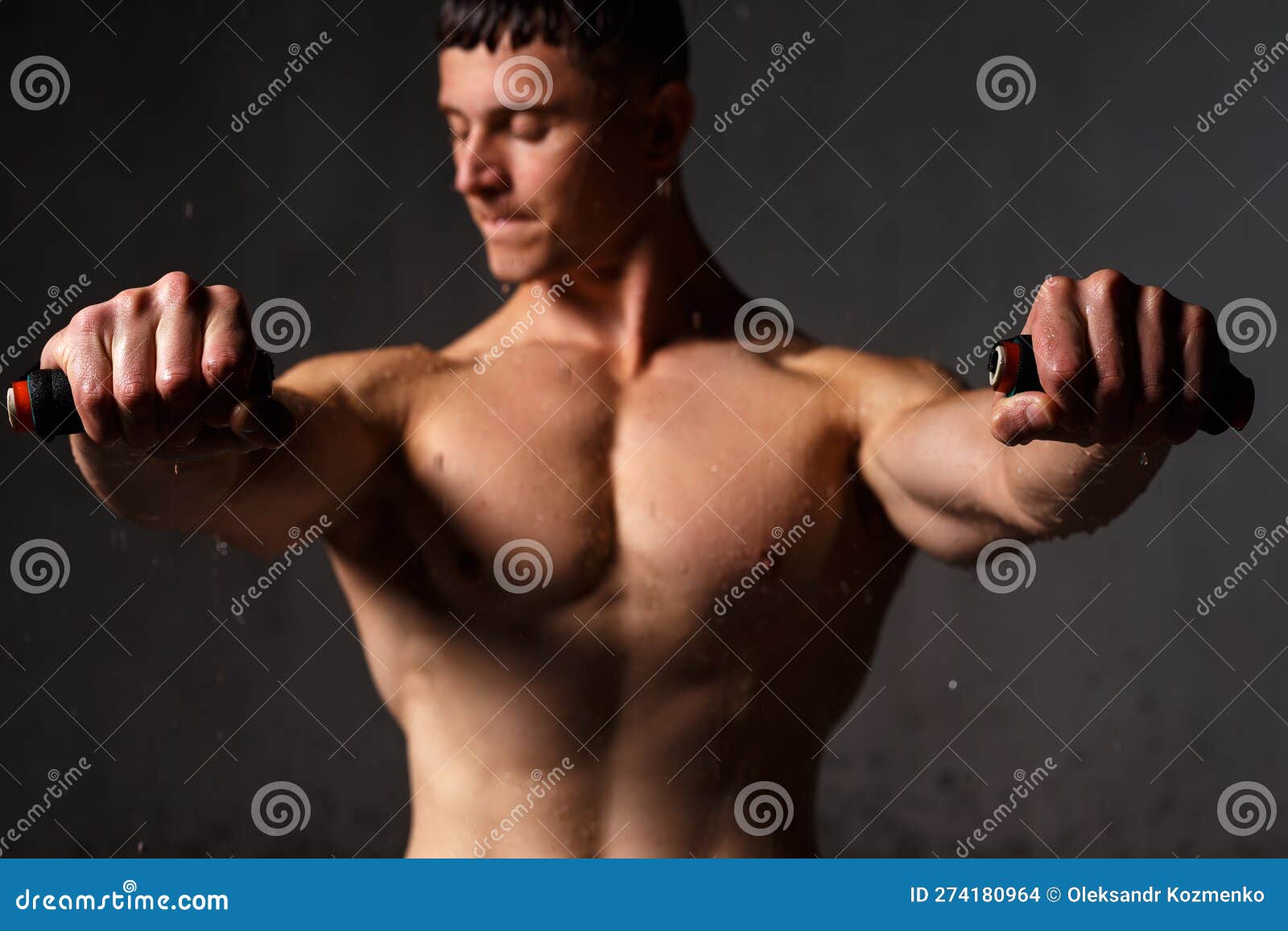 Athlete Bodybuilder Trains in the Studio in the Rain. Stock Photo ...