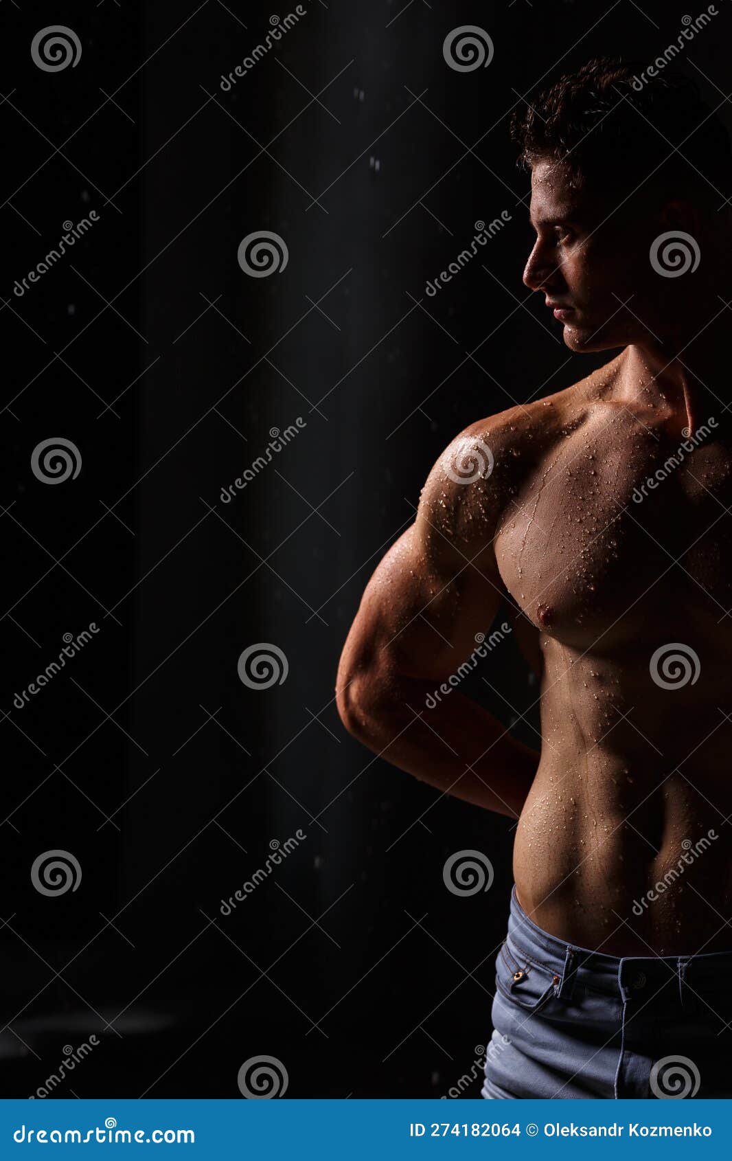 Athlete Bodybuilder Trains in the Studio in the Rain. Stock Photo ...