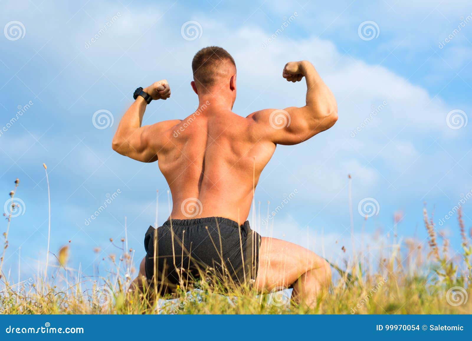 Bodybuilder Flexing Back Muscles Outdoors Stock Photo - Image of ...