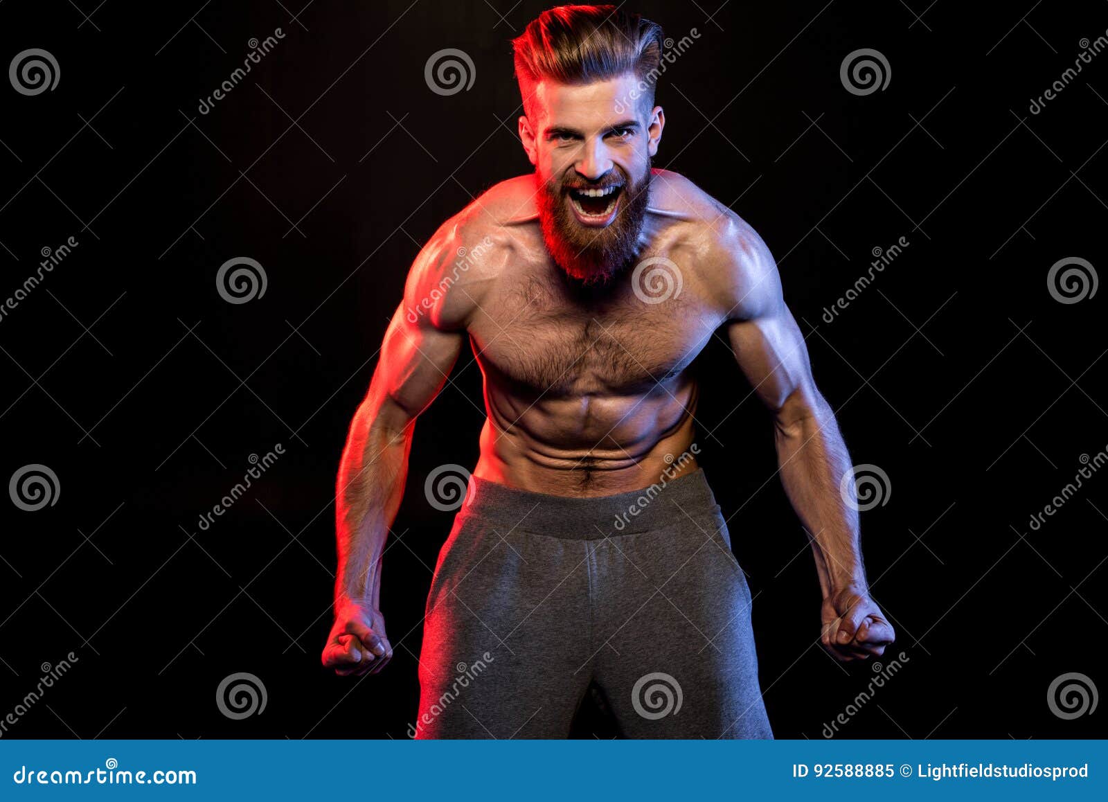 Bodybuilder Gesturing and Yelling Isolated on Black with Dramatic ...