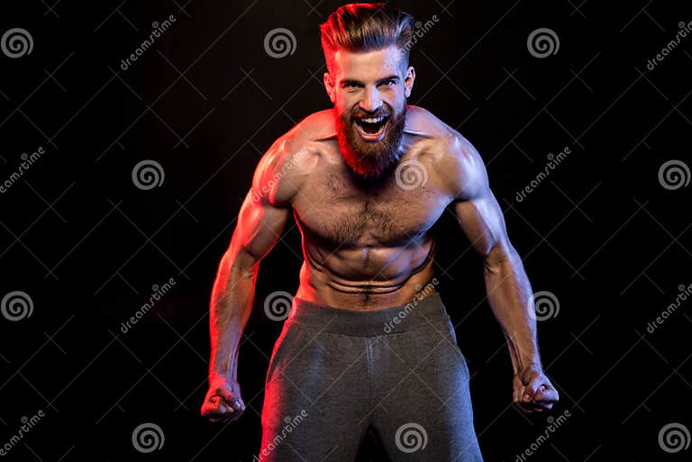 Bodybuilder Gesturing and Yelling Isolated on Black with Dramatic ...