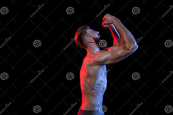 Bodybuilder Gesturing and Yelling Isolated on Black with Dramatic ...