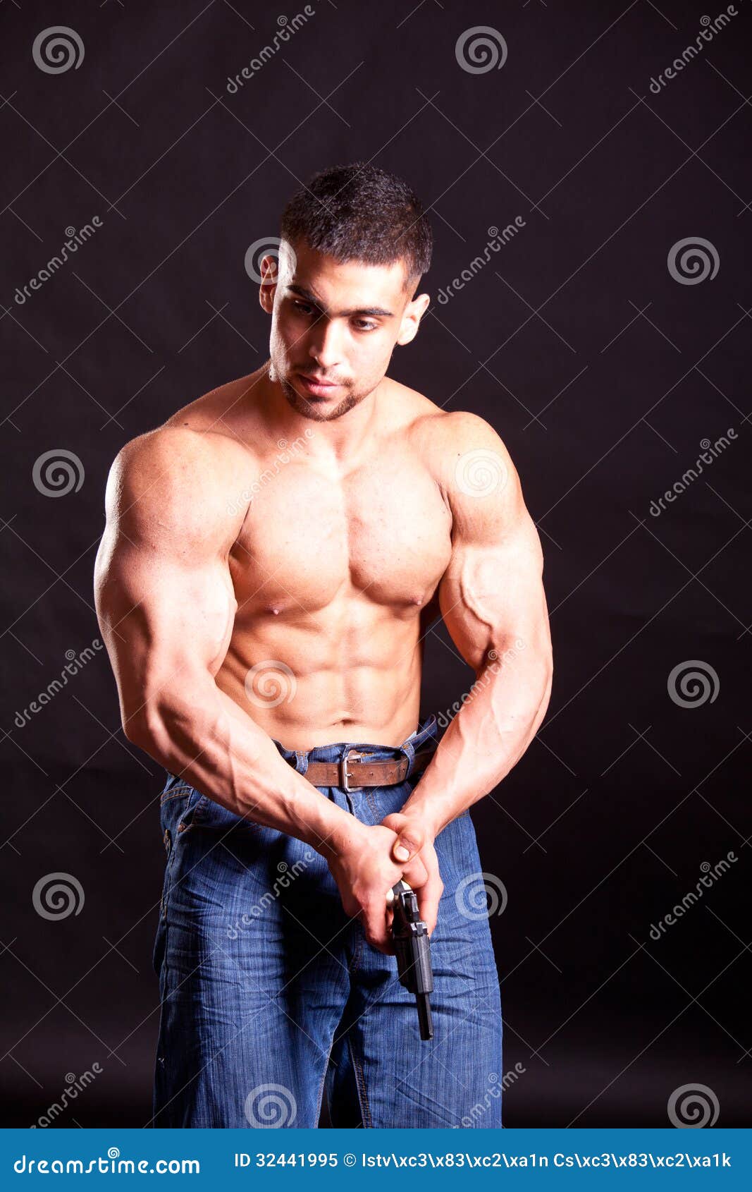 Bodybuilder with gun stock image. Image of attractive - 32441995