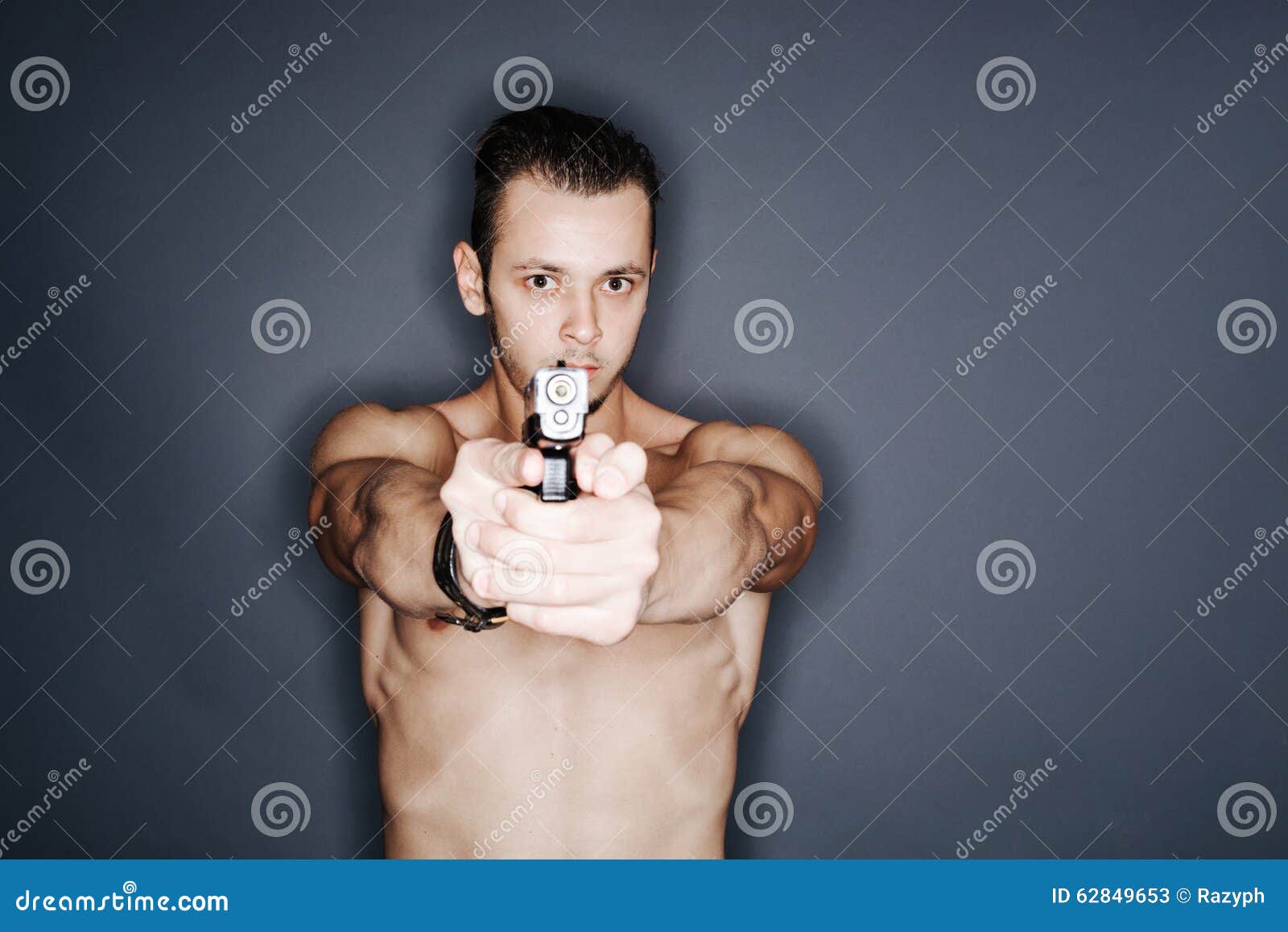 Bodybuilder with gun stock image. Image of lifting, muscle - 62849653