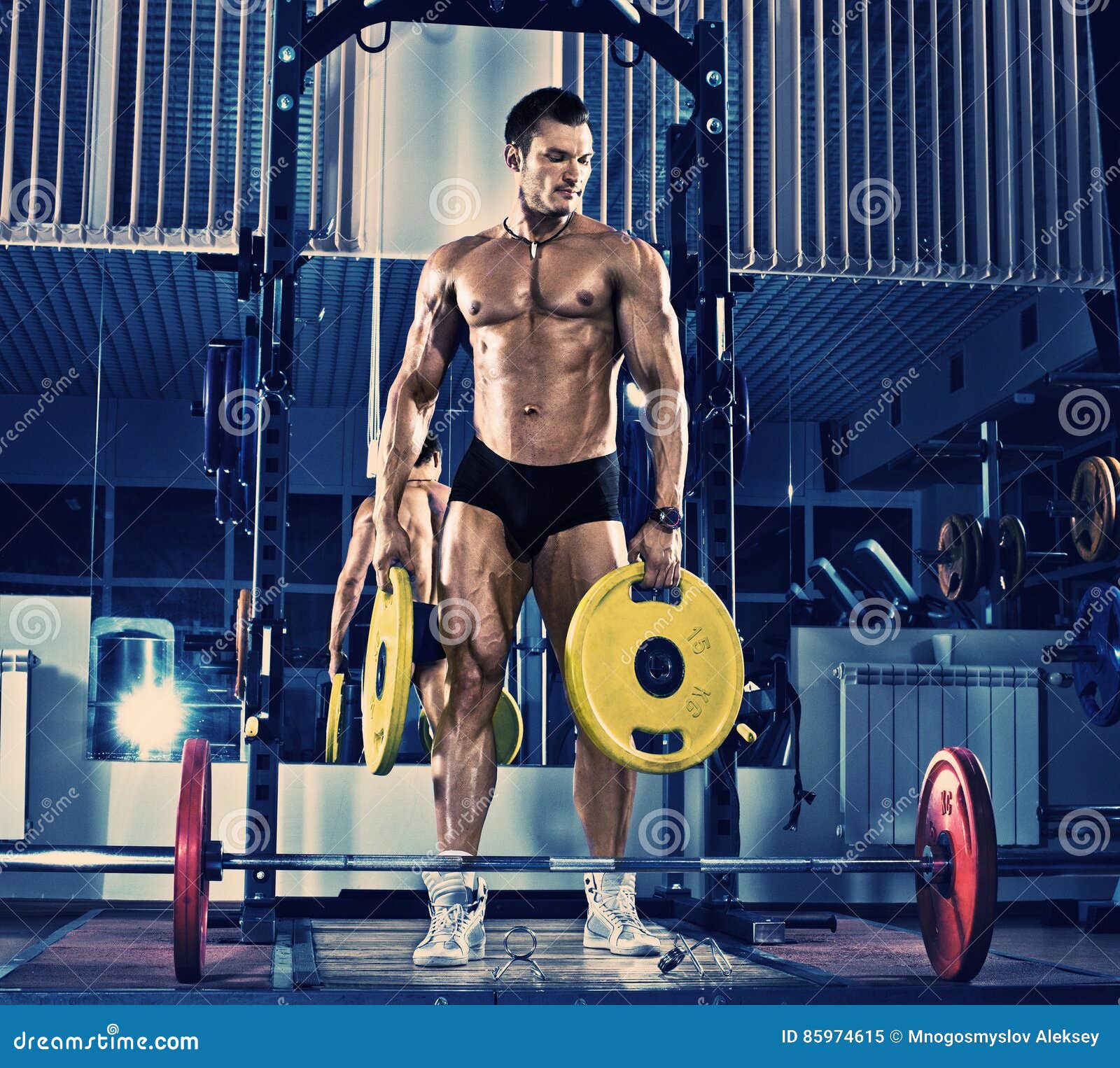 Bodybuilder in gym stock image. Image of musculation - 85974615