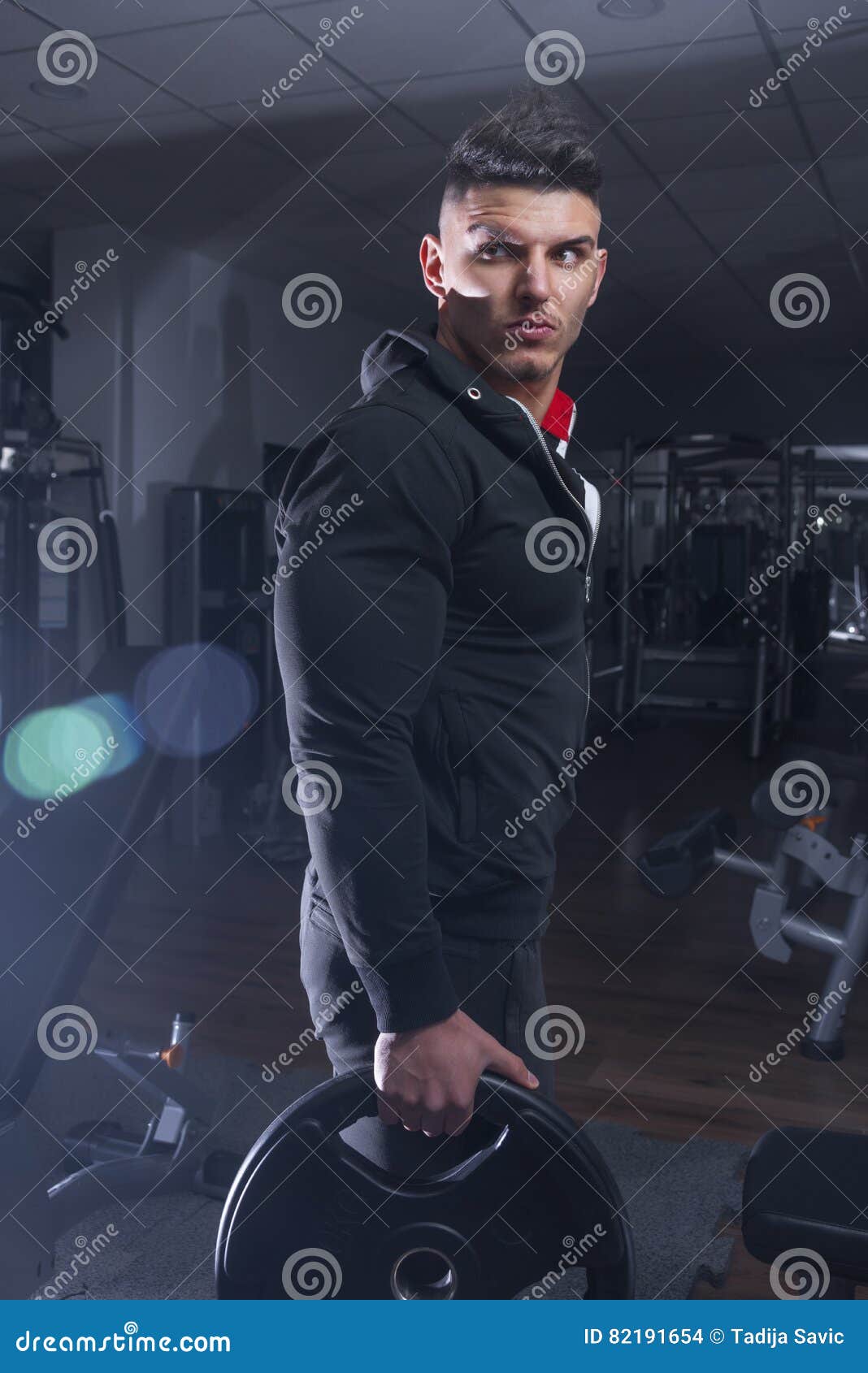 Bodybuilder hold dumbbell stock photo. Image of dumbbell - 82191654