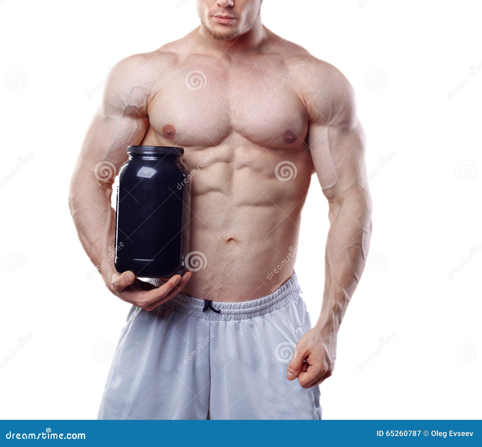 Bodybuilder Holding a Black Plastic Jar with Whey Protein on White ...