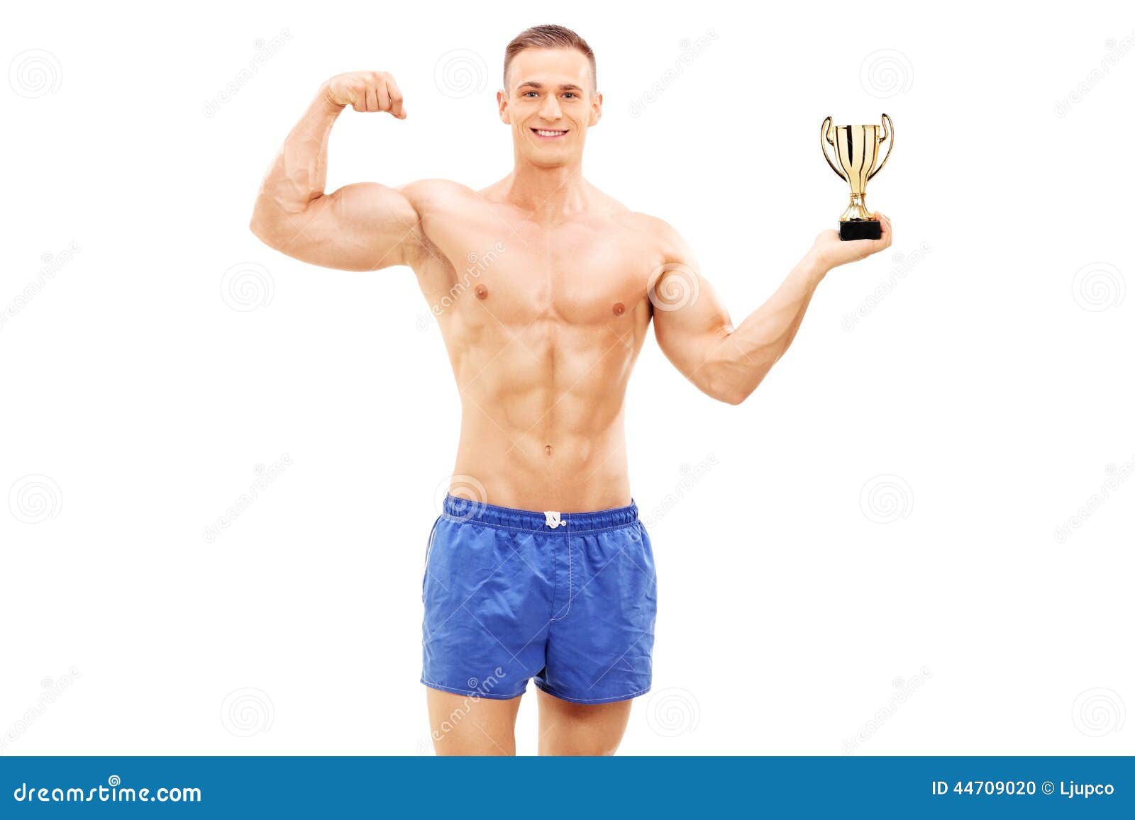 Bodybuilder Holding Golden Trophy Photos - Free & Royalty-Free Stock ...
