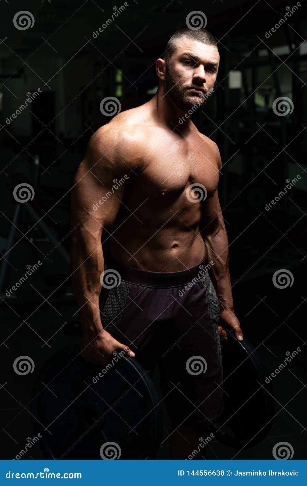 Bodybuilder Holding Weights in Hand Stock Photo - Image of equipment ...