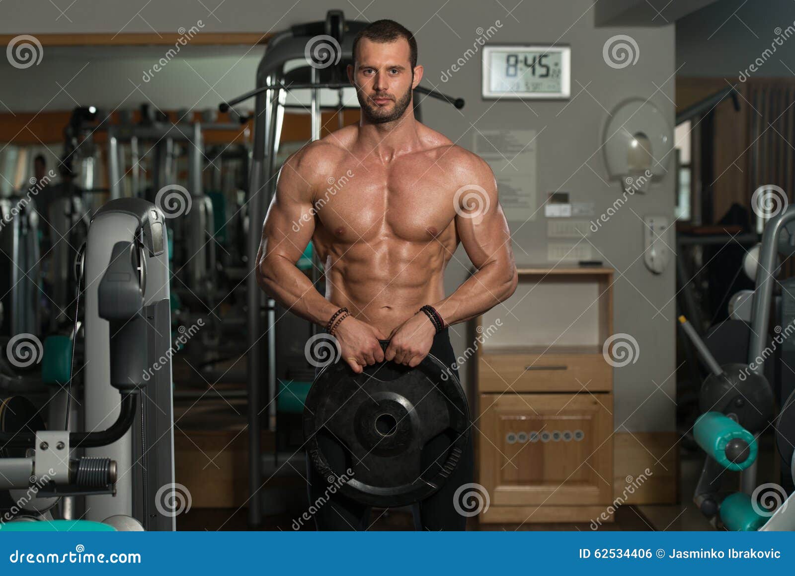 Bodybuilder Holding Weights in Hand Stock Photo - Image of bodybuilder ...