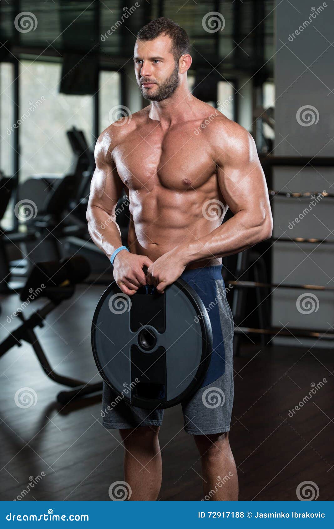 Bodybuilder Holding Weights in Hand Stock Photo - Image of competition ...