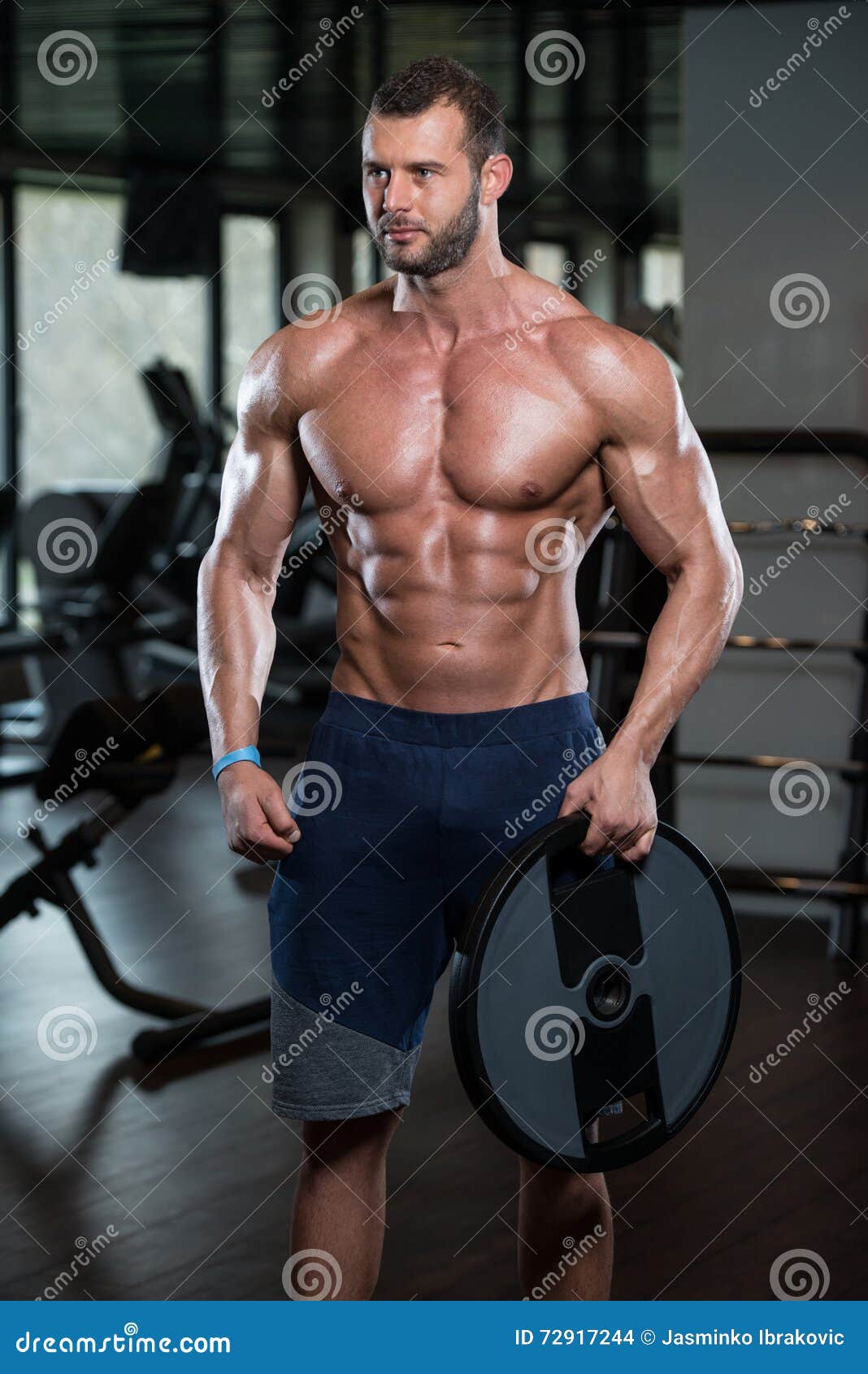 Bodybuilder Holding Weights in Hand Stock Photo - Image of health ...