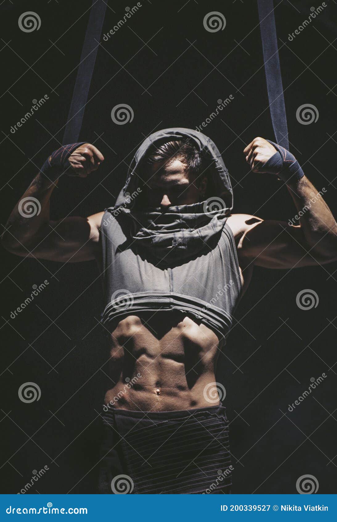 Bodybuilder in Hood Makes Pull-up in Ropes Stock Image - Image of ...