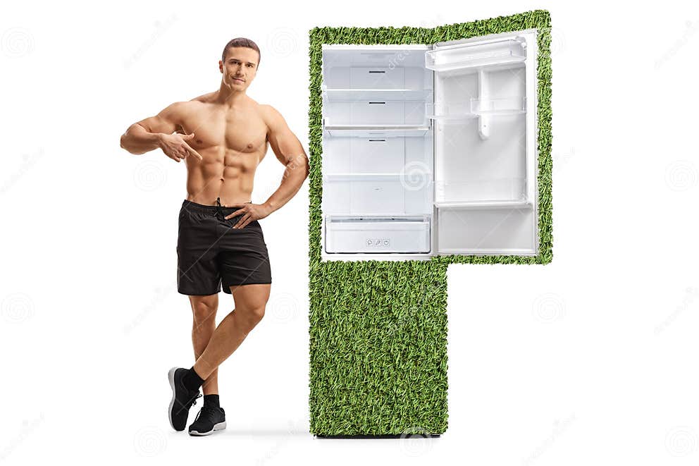 Bodybuilder Leaning on a Power Efficient Fridge and Pointing Stock ...