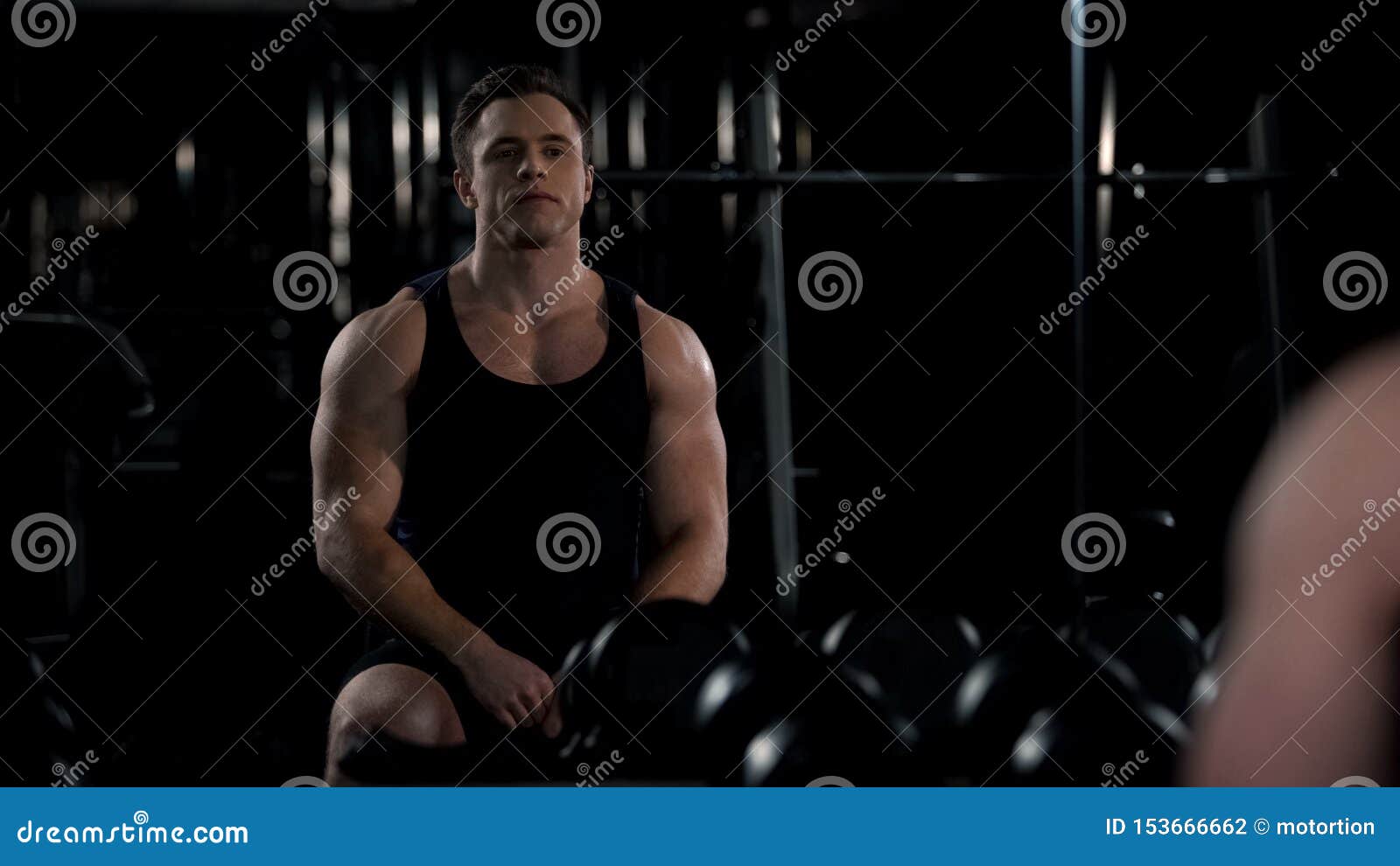 Bodybuilder Looking at Himself in Mirror after Workout, Satisfied with ...