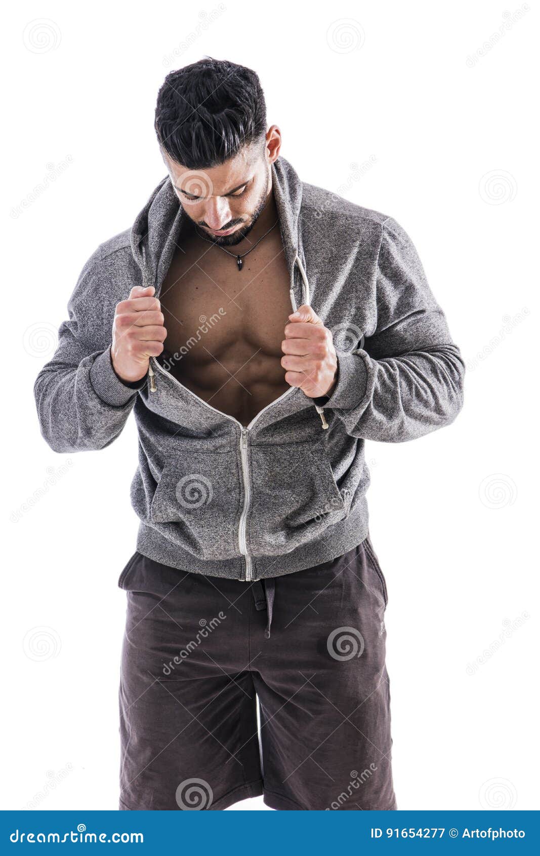 Bodybuilder Looking Inside His Shirt, Checking Out His Muscles Stock ...