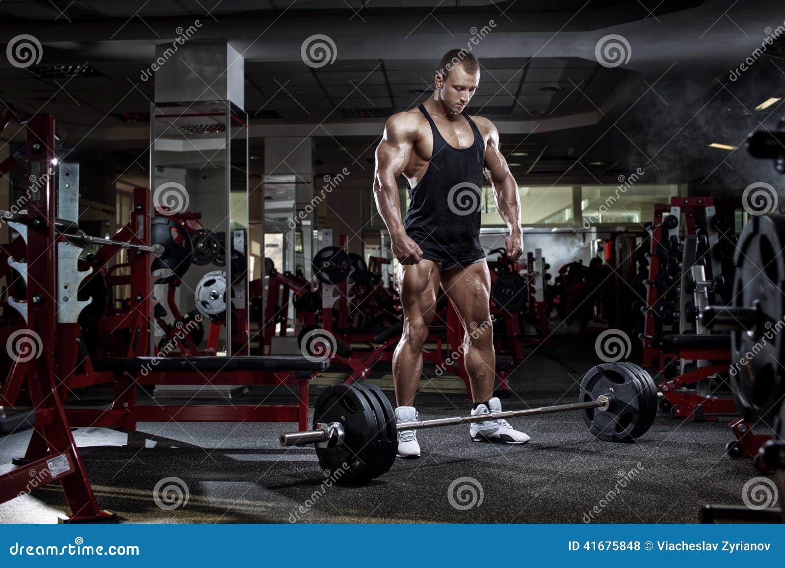 Bodybuilder Man Standing with Barbell, Workout in Gym Stock Photo ...