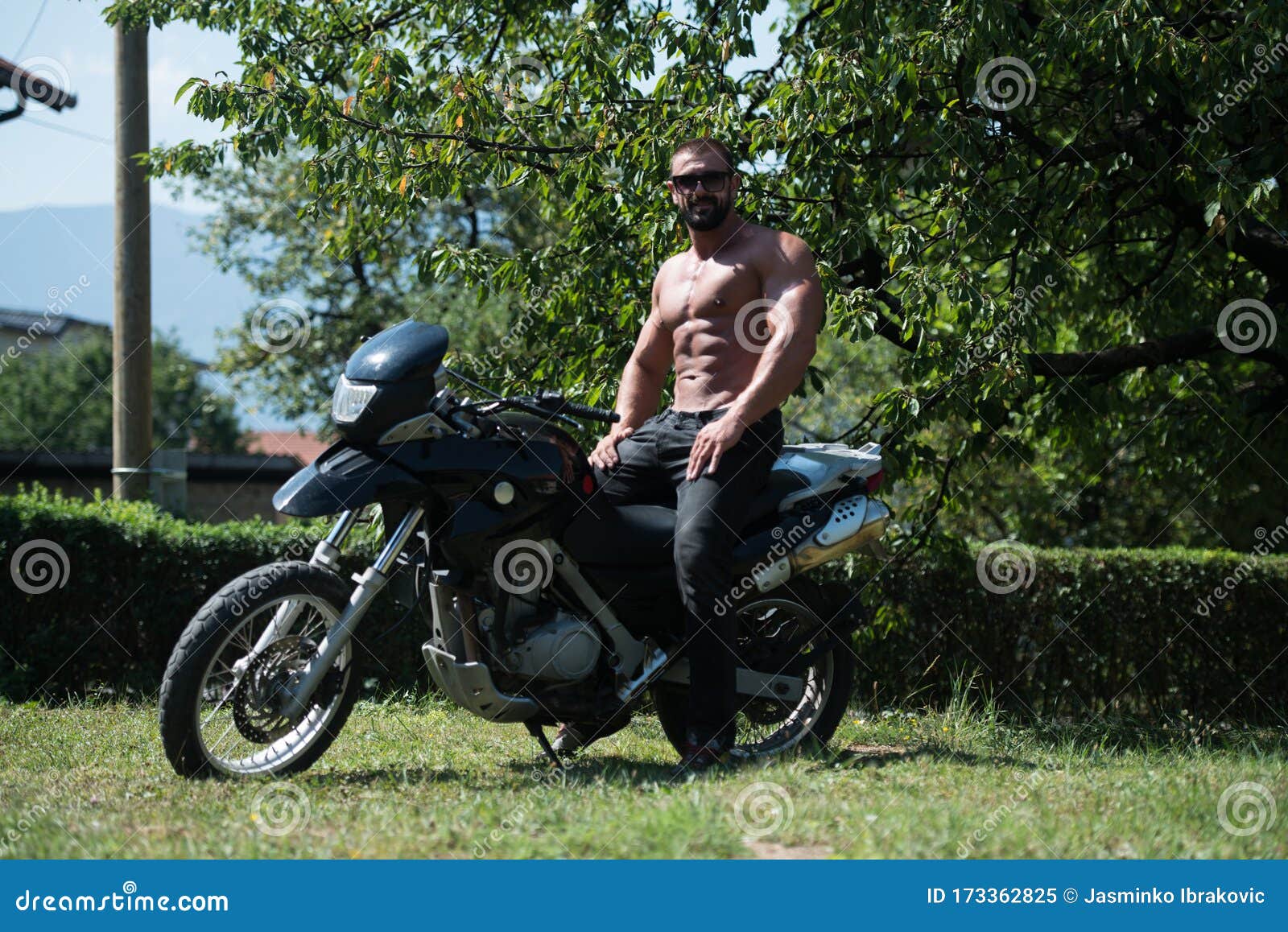Bodybuilder and Motorcycle stock image. Image of bike - 173362825