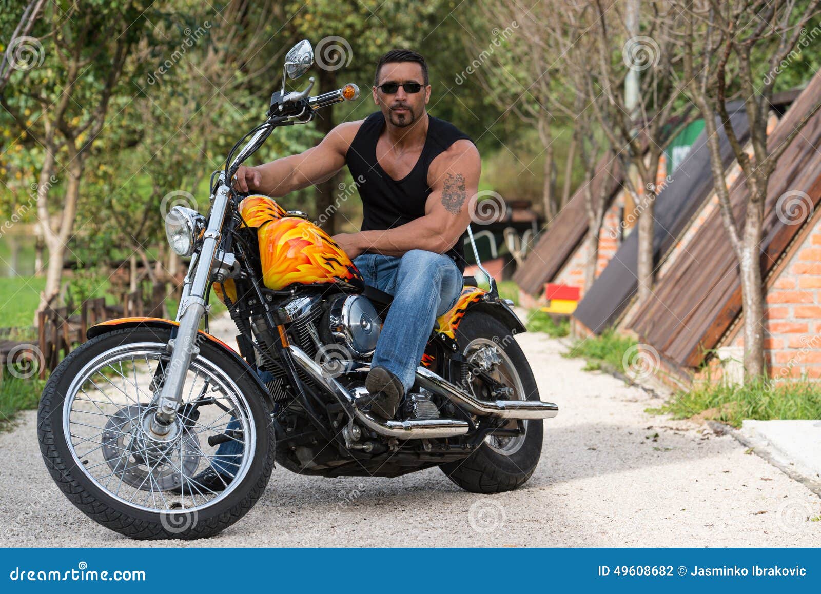 Bodybuilder and Motorcycle stock photo. Image of headlight - 49608682