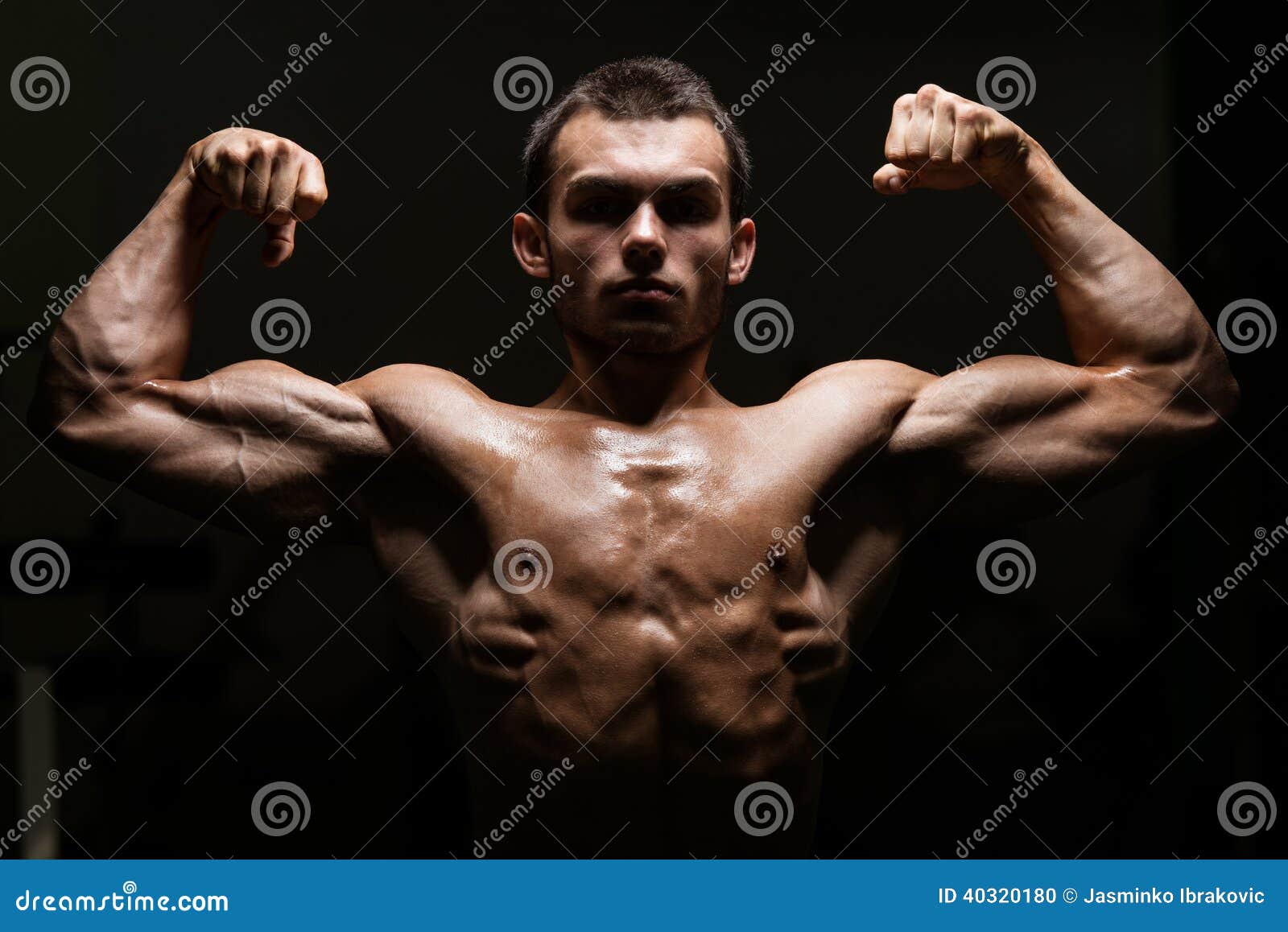 A Man With Biceps Poses For The Camera. Stock Photography ...